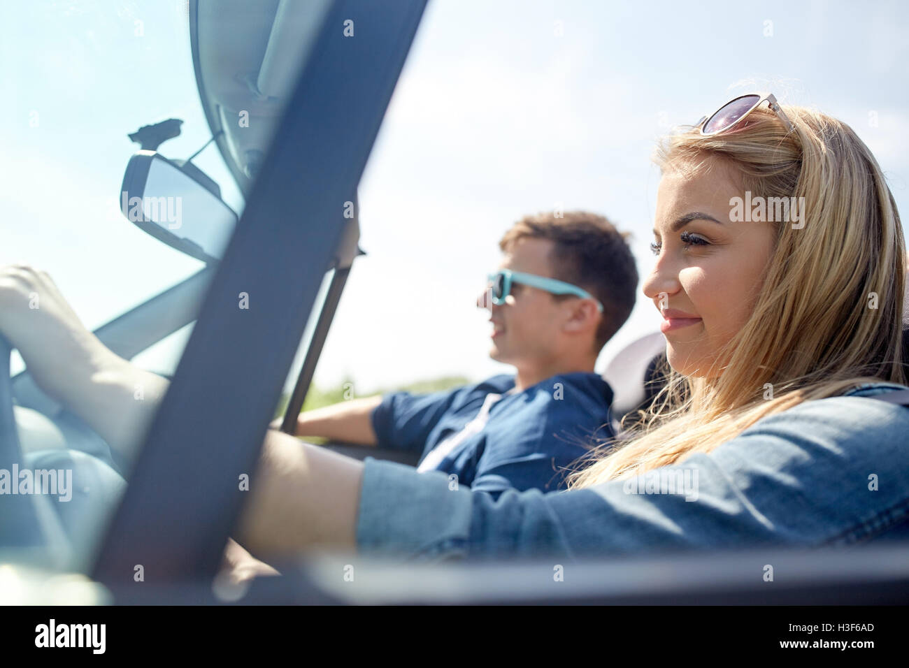 happy couple driving in cabriolet car outdoors Stock Photo - Alamy