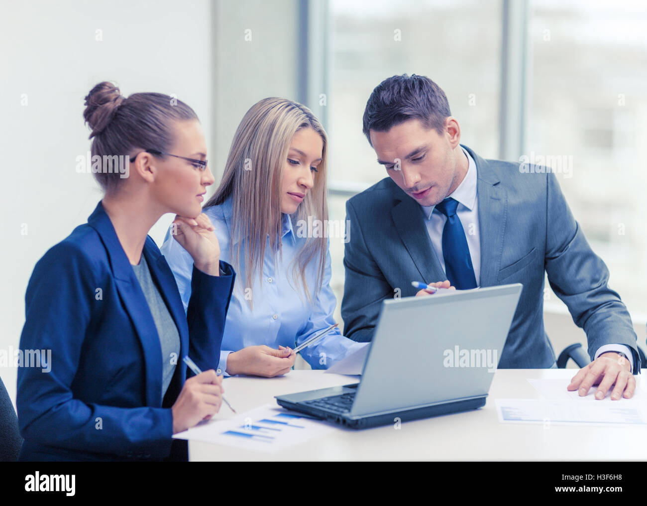 Young professionals having discussion hi-res stock photography and ...