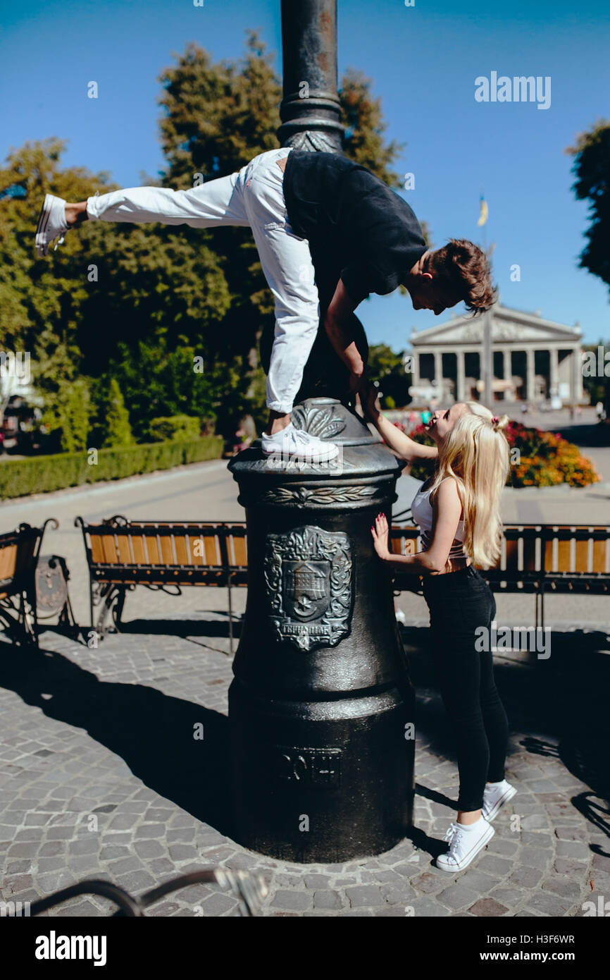 man and woman performing acrobatic tricks Stock Photo - Alamy