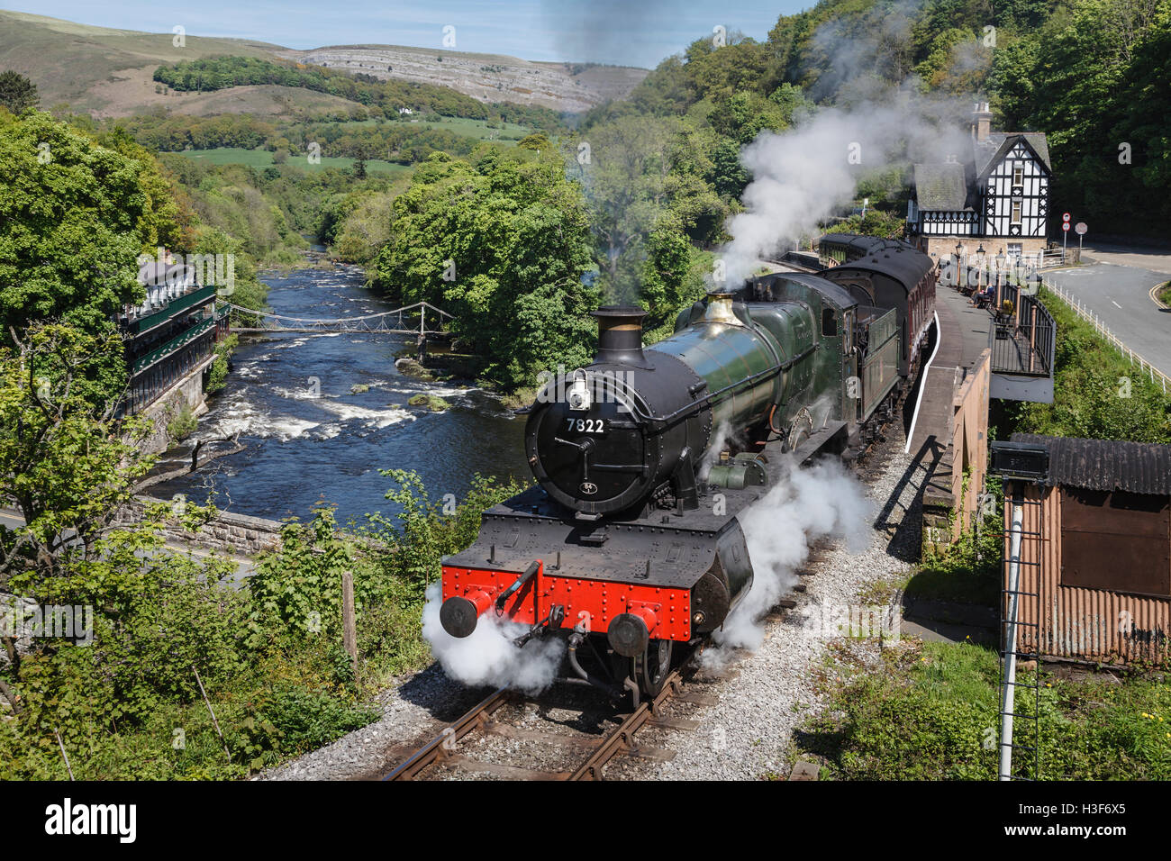 Train at Berwyn Station with a view of the River Dee and the chain ...
