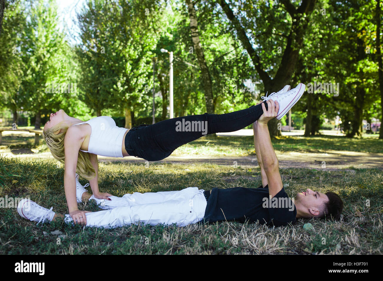man and woman performing tricks Stock Photo - Alamy