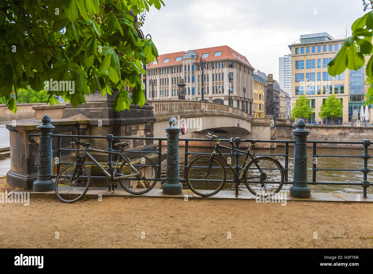 The bridge over the river Spree and a few bicycles chained to the ...