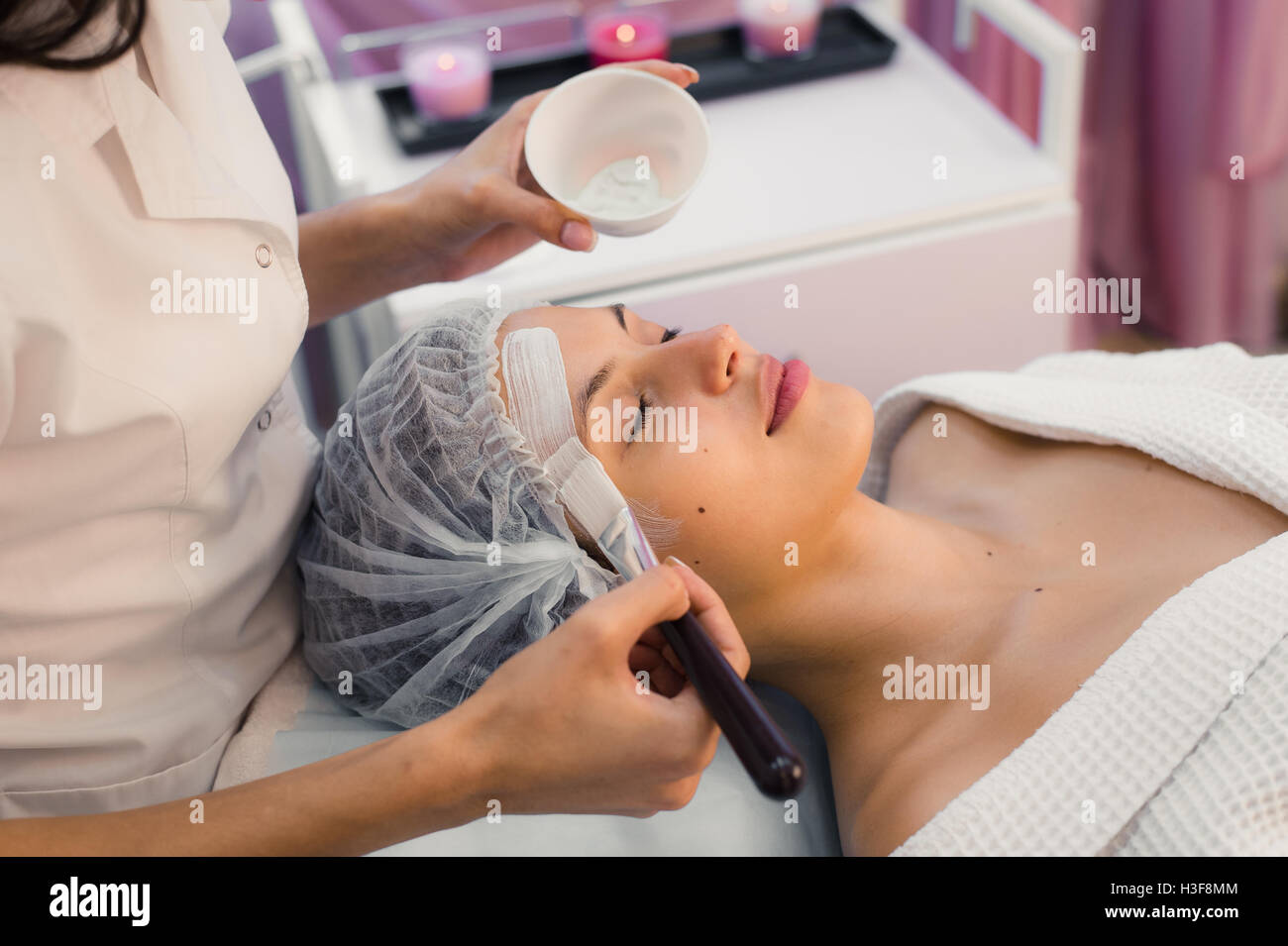 Young beautiful woman having spa procedure on her face Stock Photo - Alamy