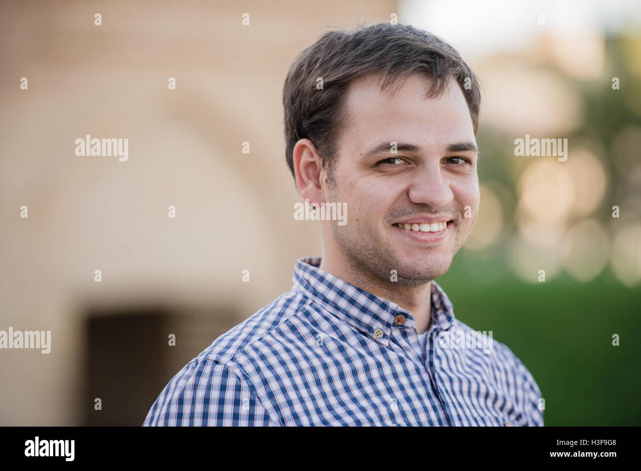 Portrait of young happy smiling man, outdoors Stock Photo - Alamy