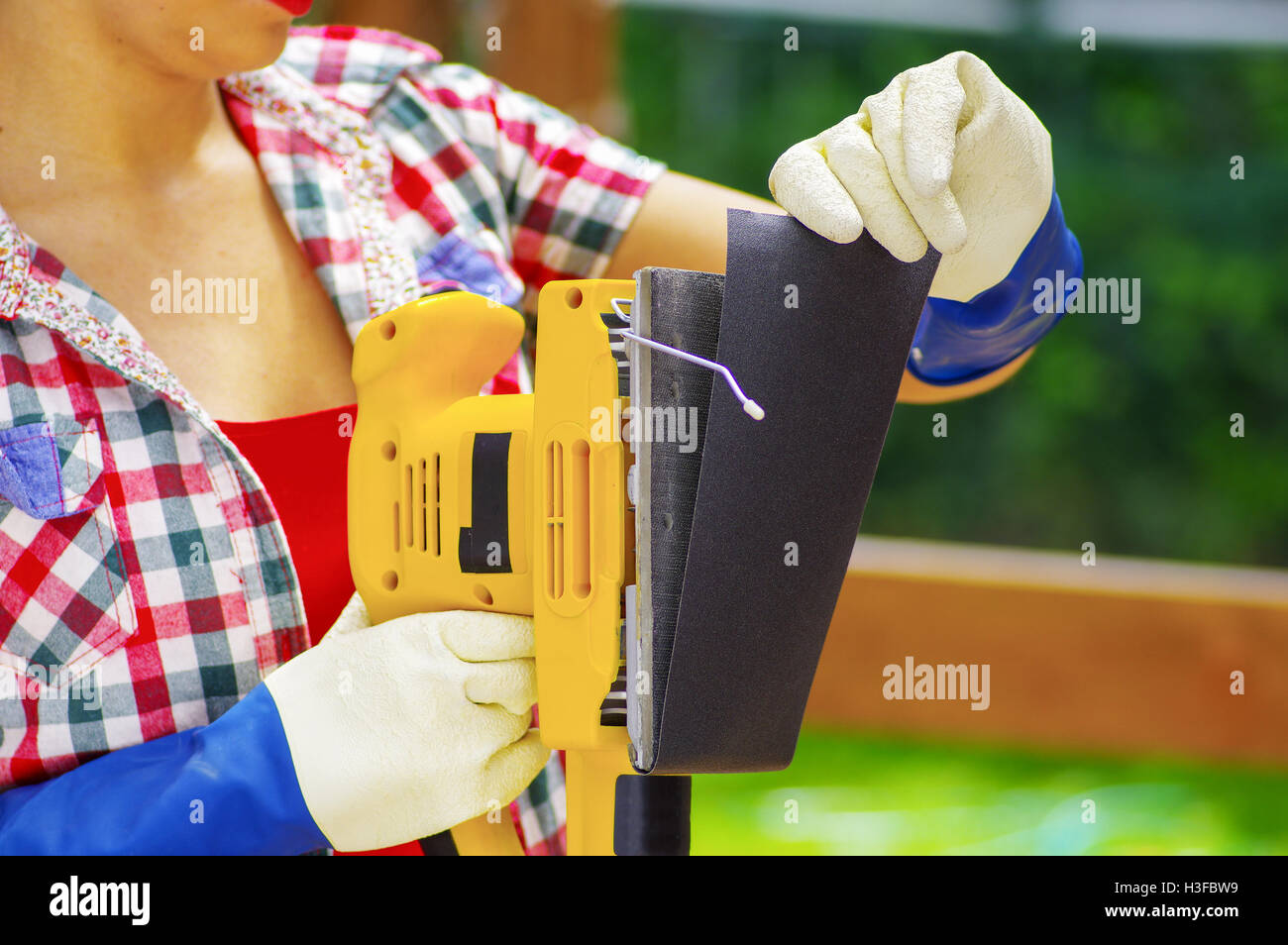 Female electric sander hi-res stock photography and images - Alamy