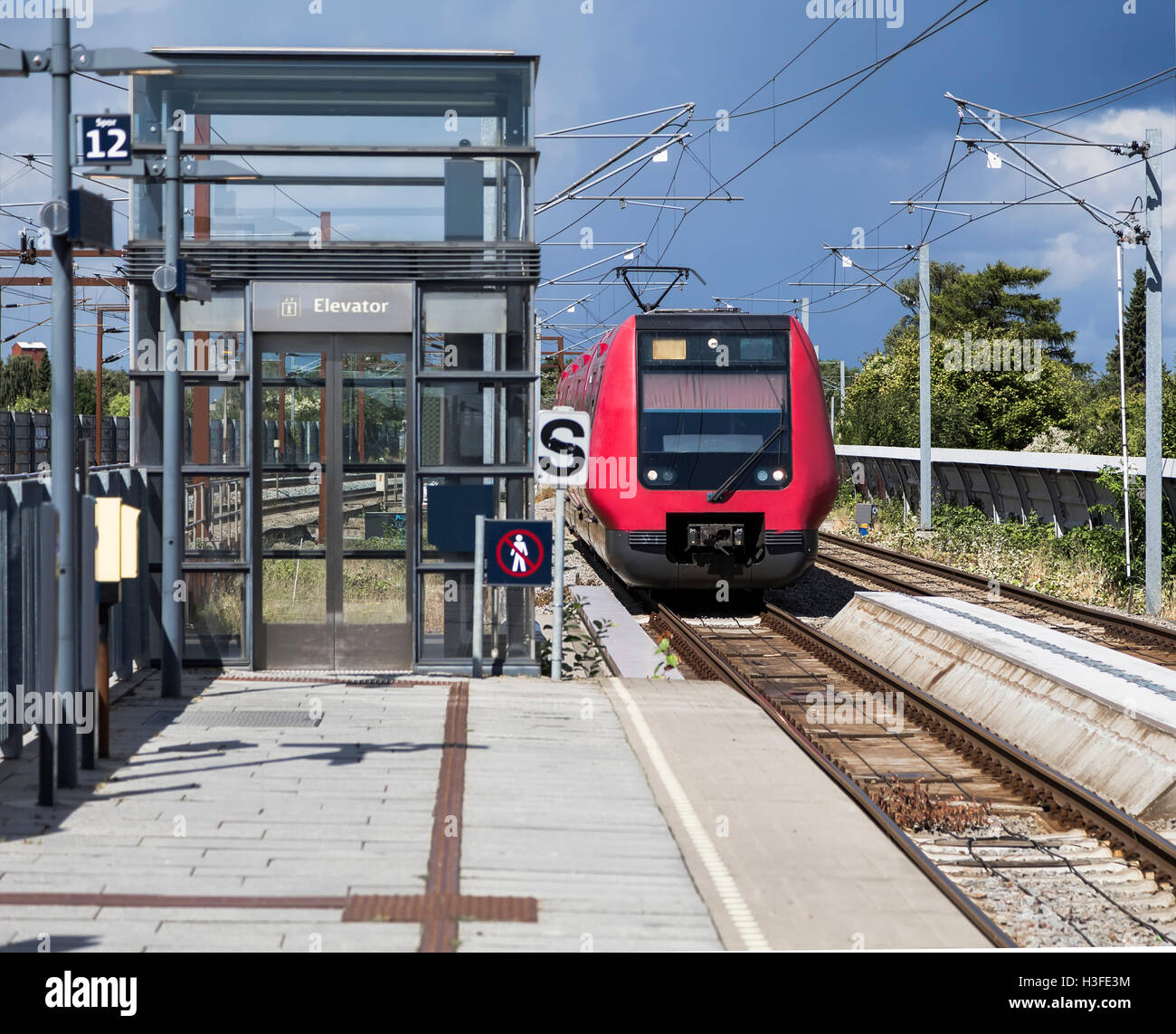 Urban train approaches the platform. Copenhagen. Denmark Stock Photo ...