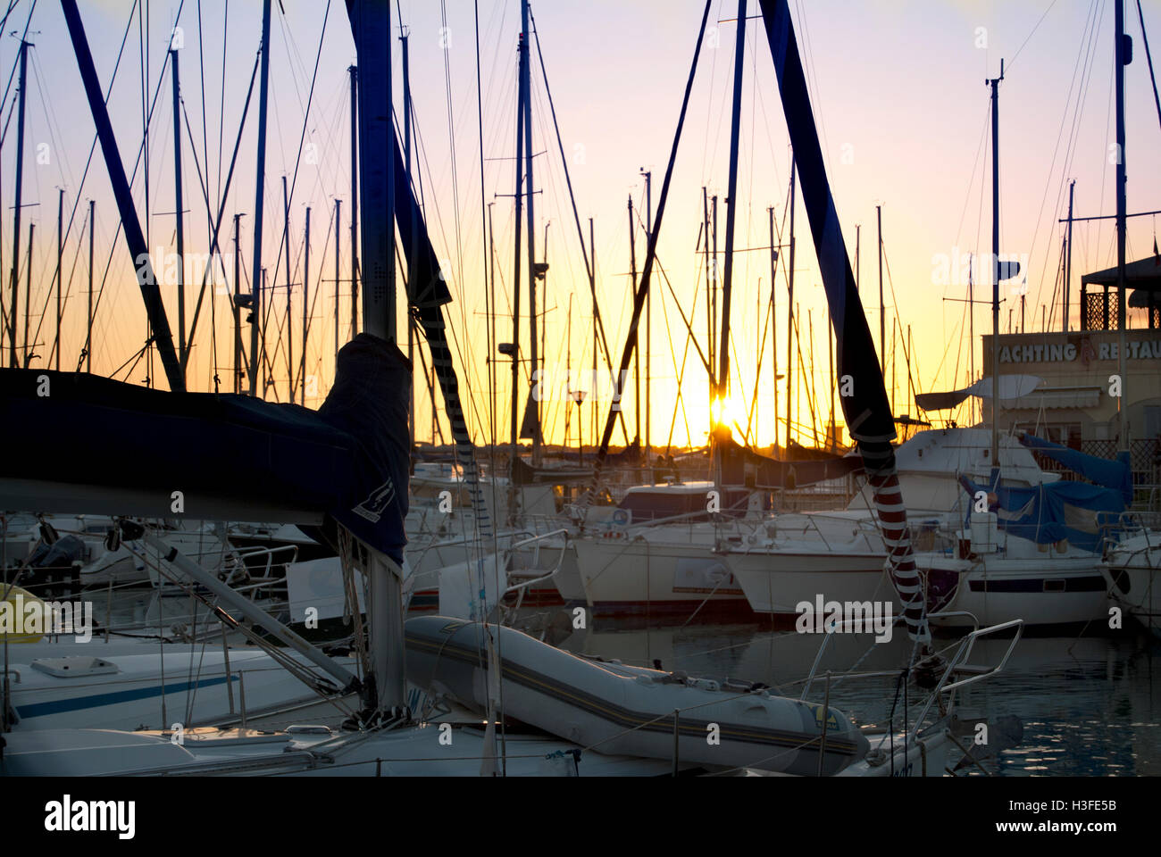 boats and sailboats in the harbour Rome at the sunset Stock Photo - Alamy