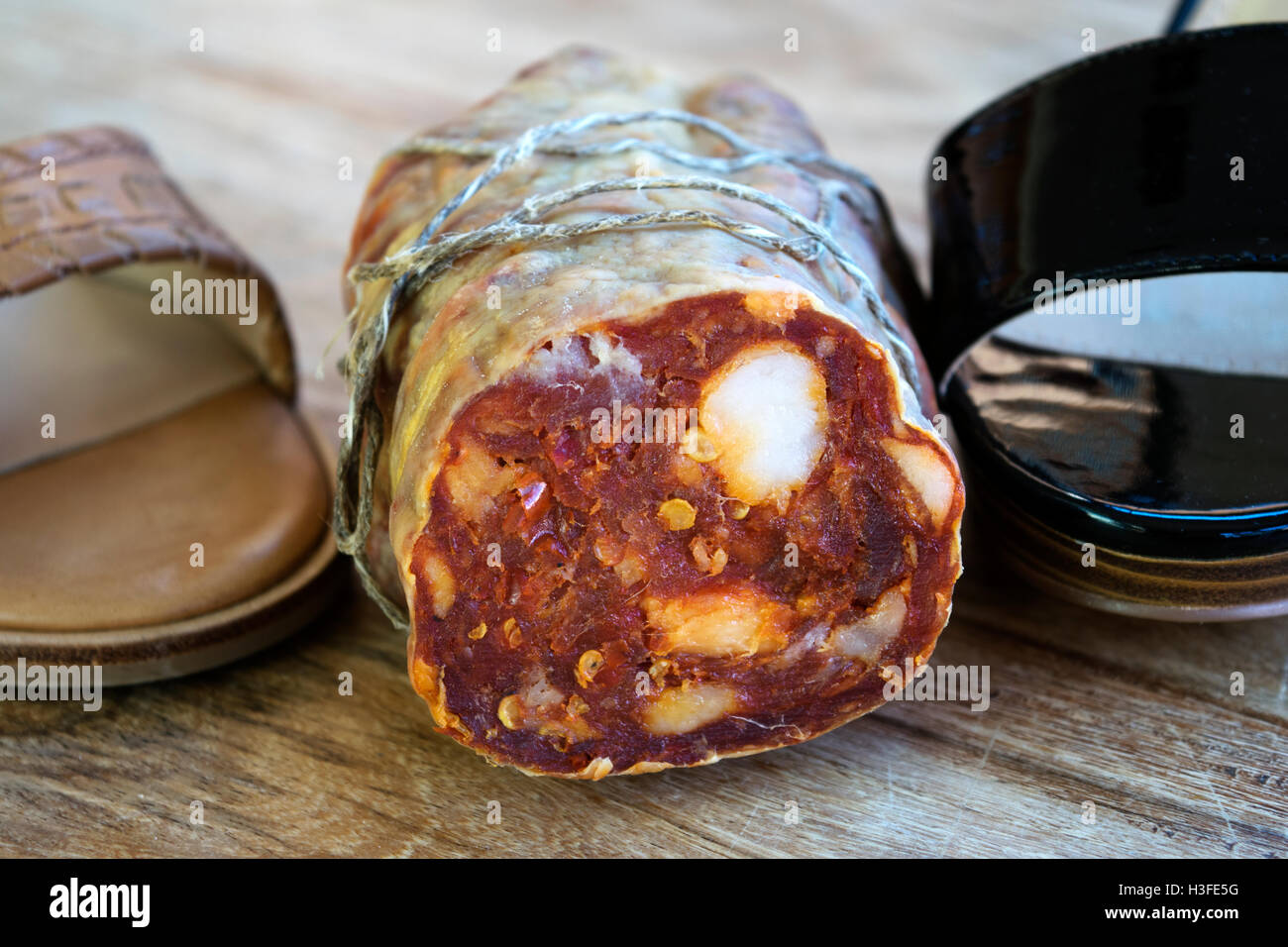 soppressata salami photographed near women shoes Stock Photo - Alamy