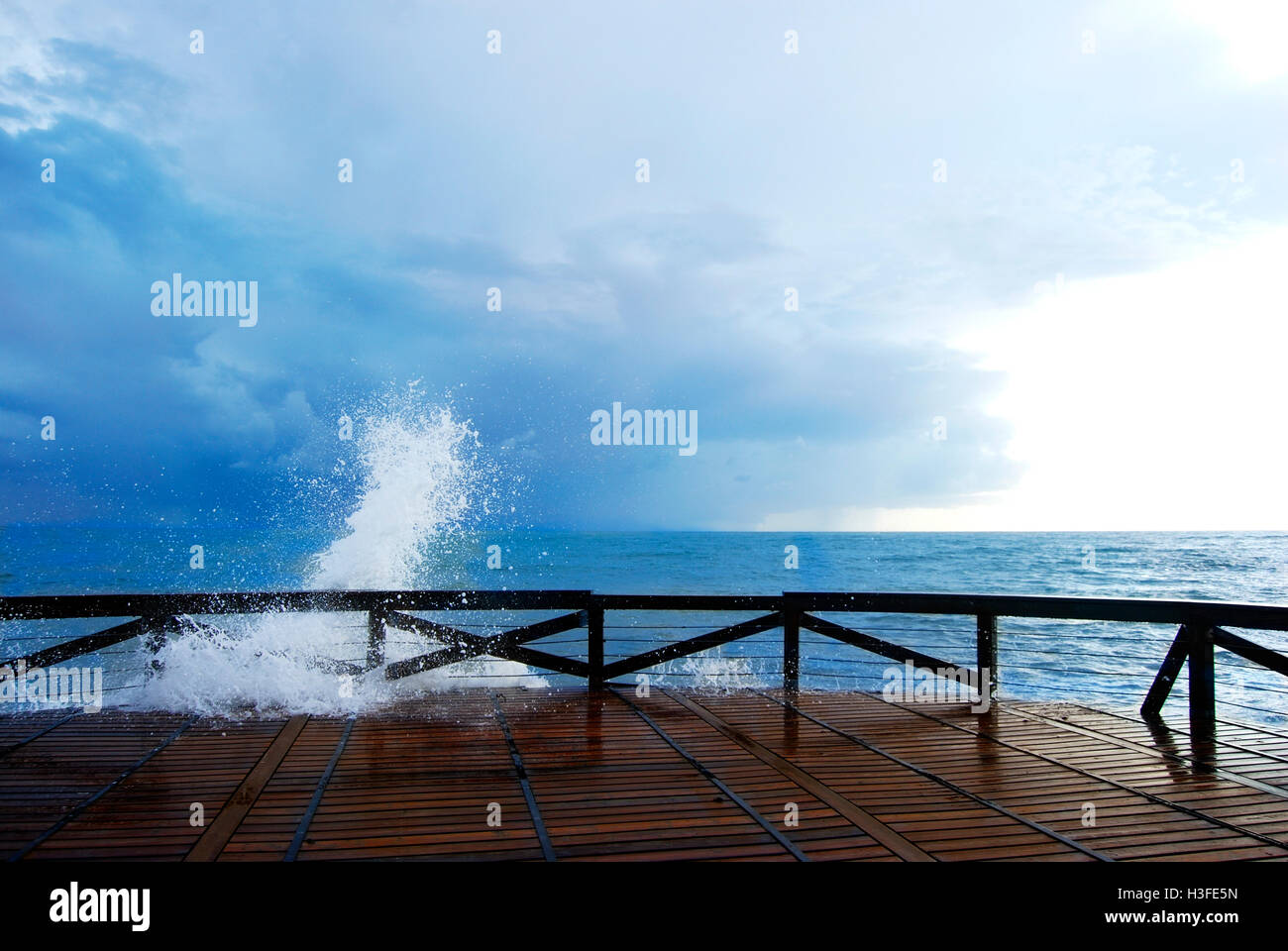 splash of blue sea in a wood landing Stock Photo - Alamy