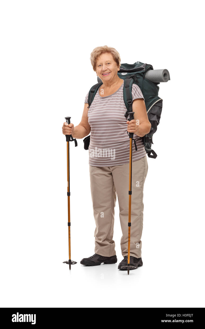 Full length portrait of a mature female hiker posing with hiking ...