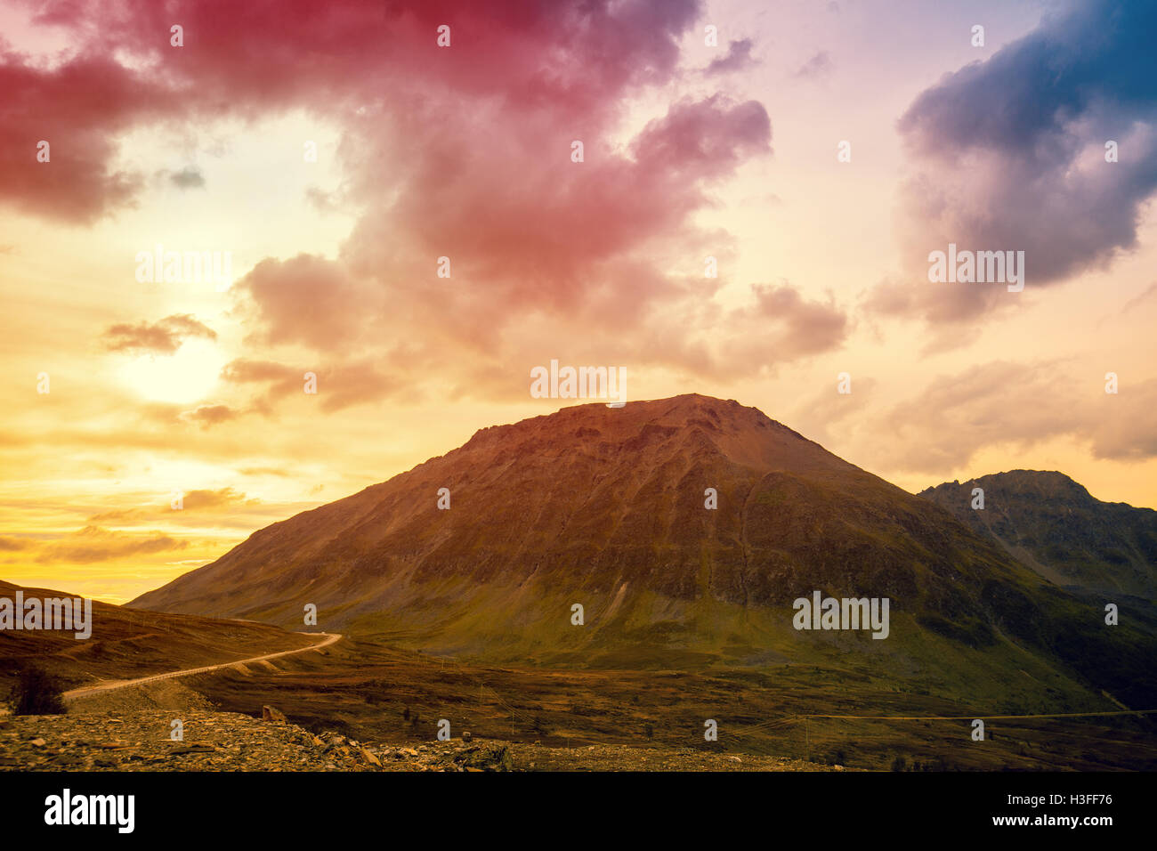 Mountain with colorful cloudy sky at sunset Stock Photo - Alamy