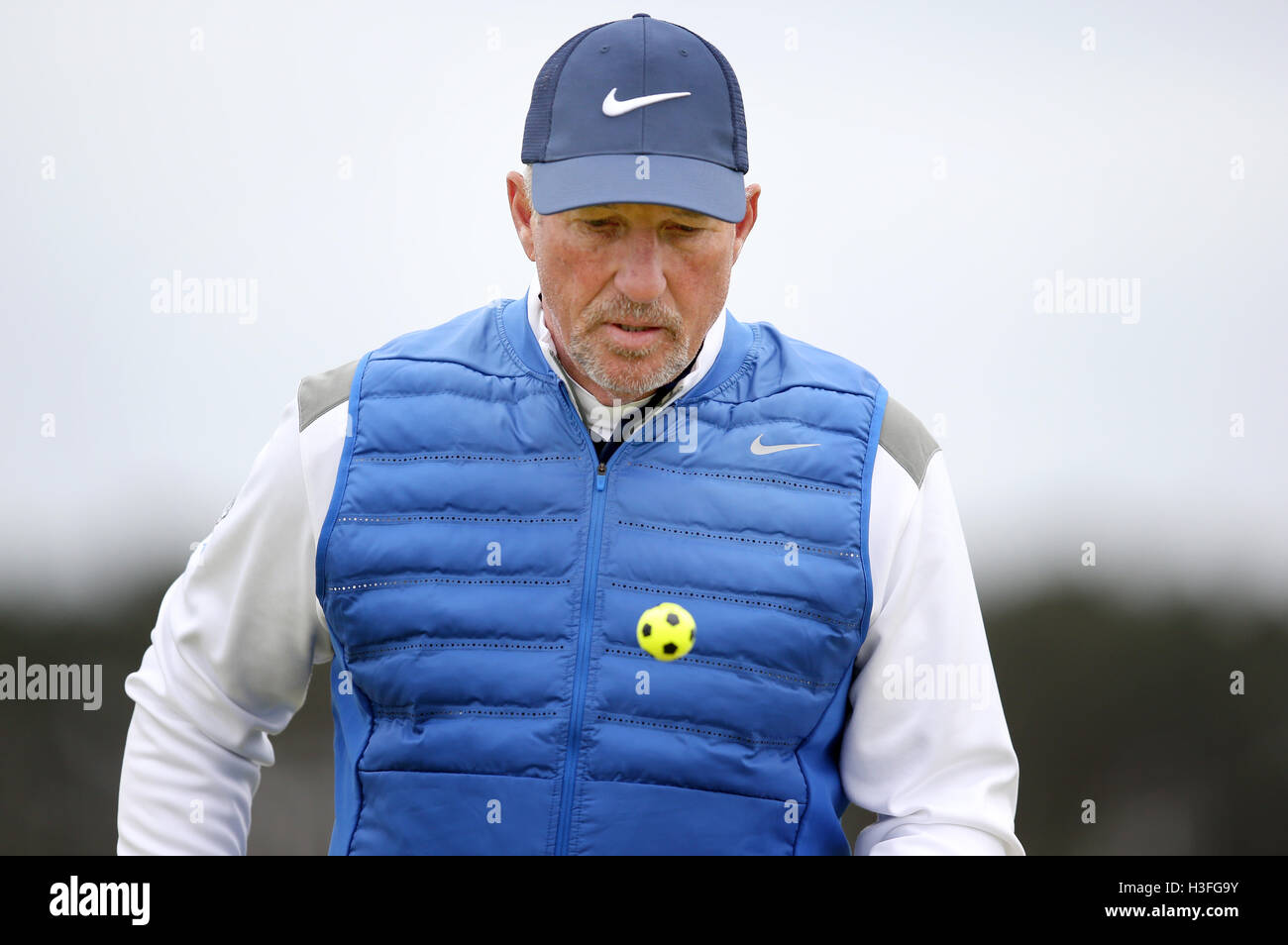 Sir Ian Botham, with his 'football' golf ball on the 13th green during ...