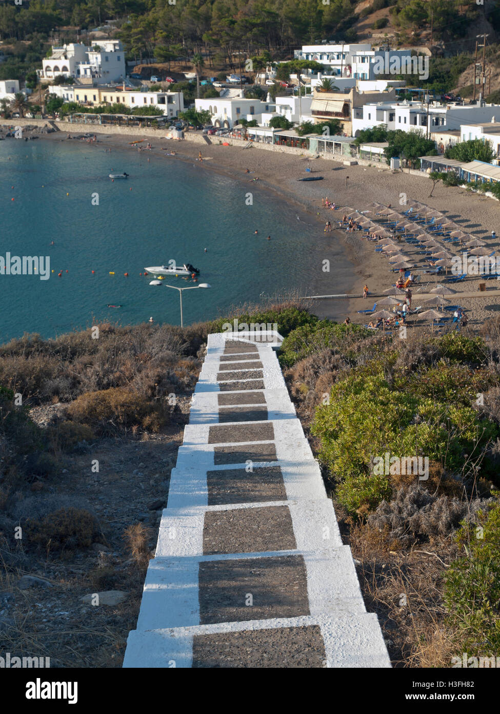 Steps down to the beach and bay in Kapsali on the Greek island of ...
