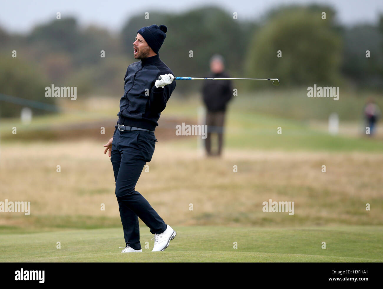 Jamie Redknapp reacts after hitting into the rough on the 5th hole ...