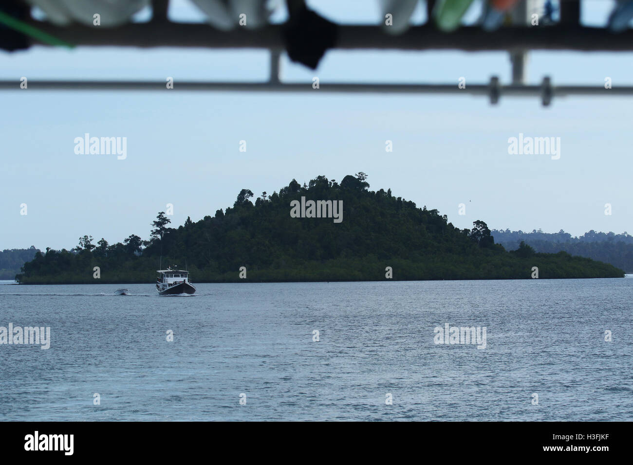 Boat and Island Stock Photo - Alamy
