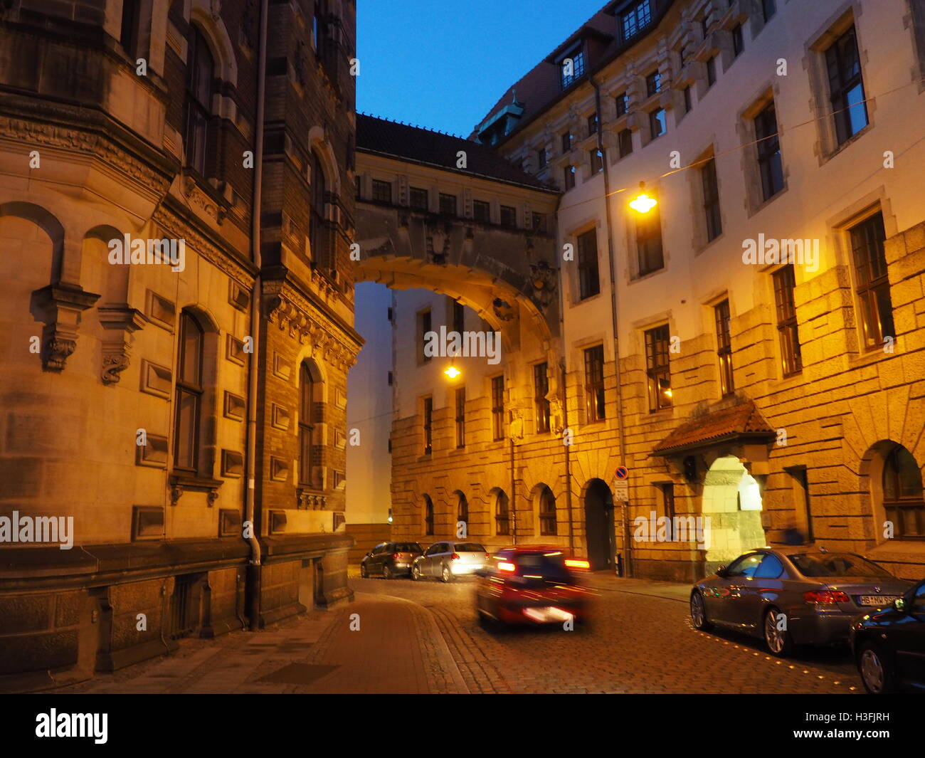 Red Car moving in through a historical area Stock Photo - Alamy