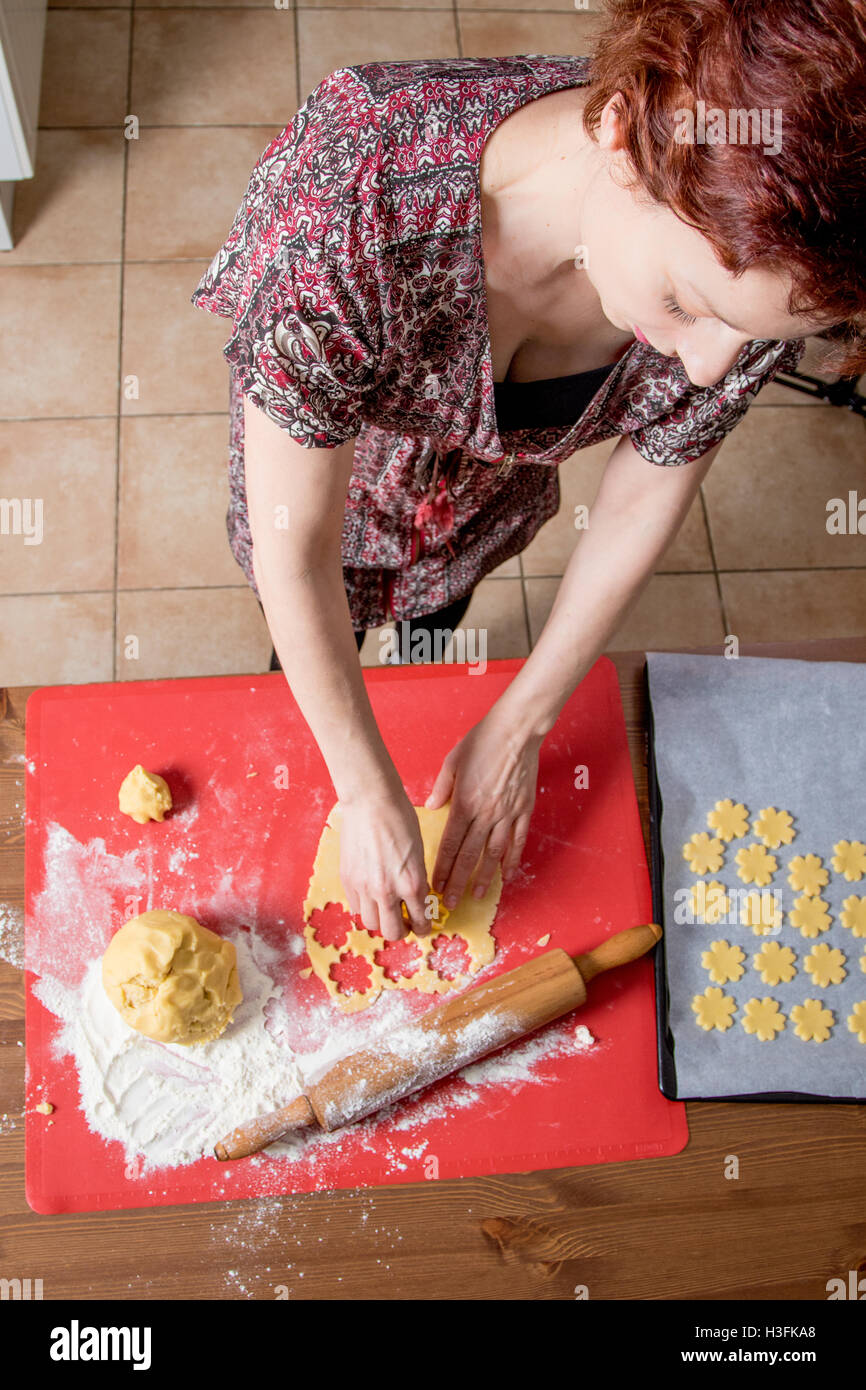 Woman baking homemade Christmas cookies Stock Photo - Alamy