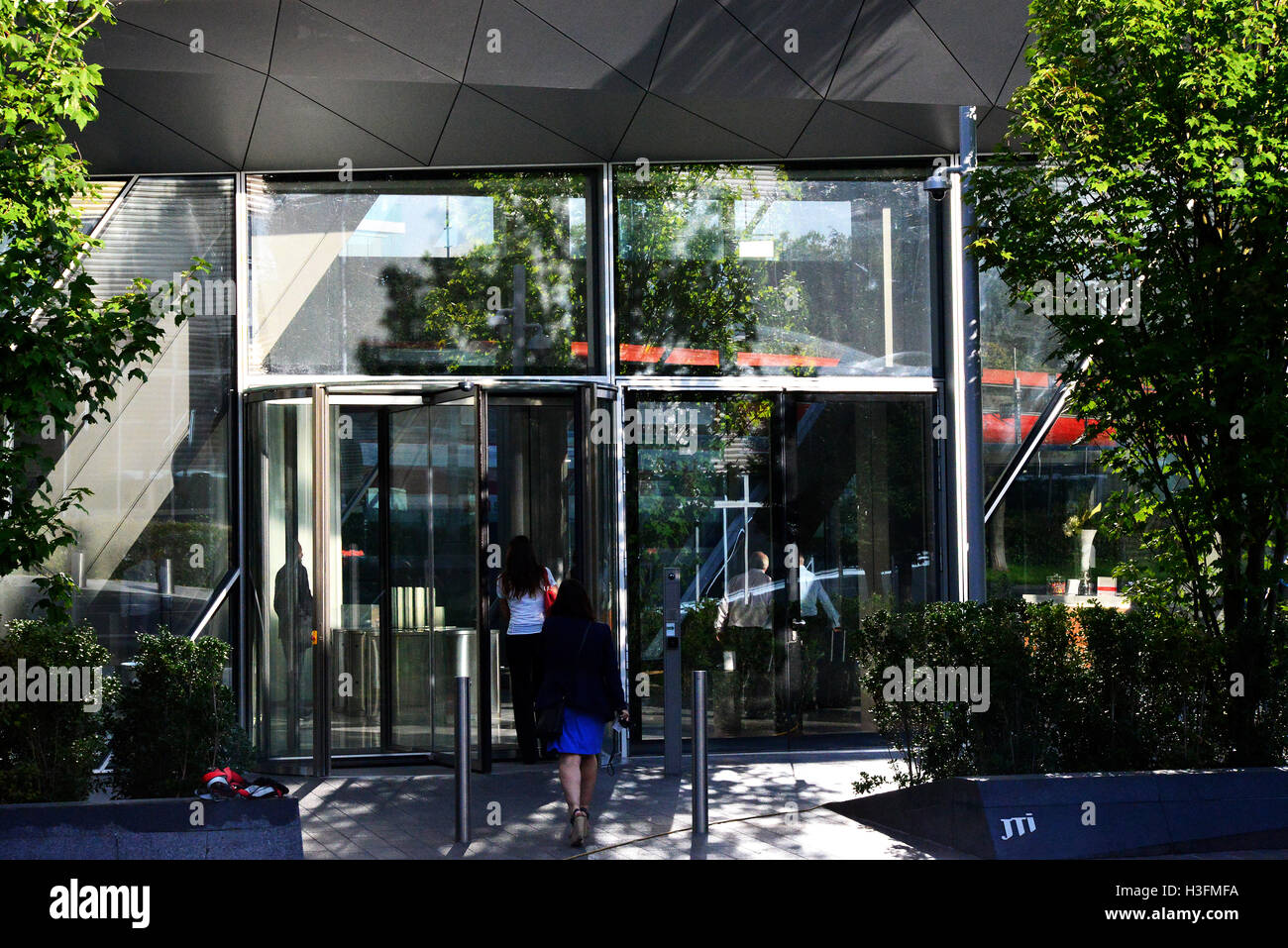 Employes entering the office Stock Photo - Alamy