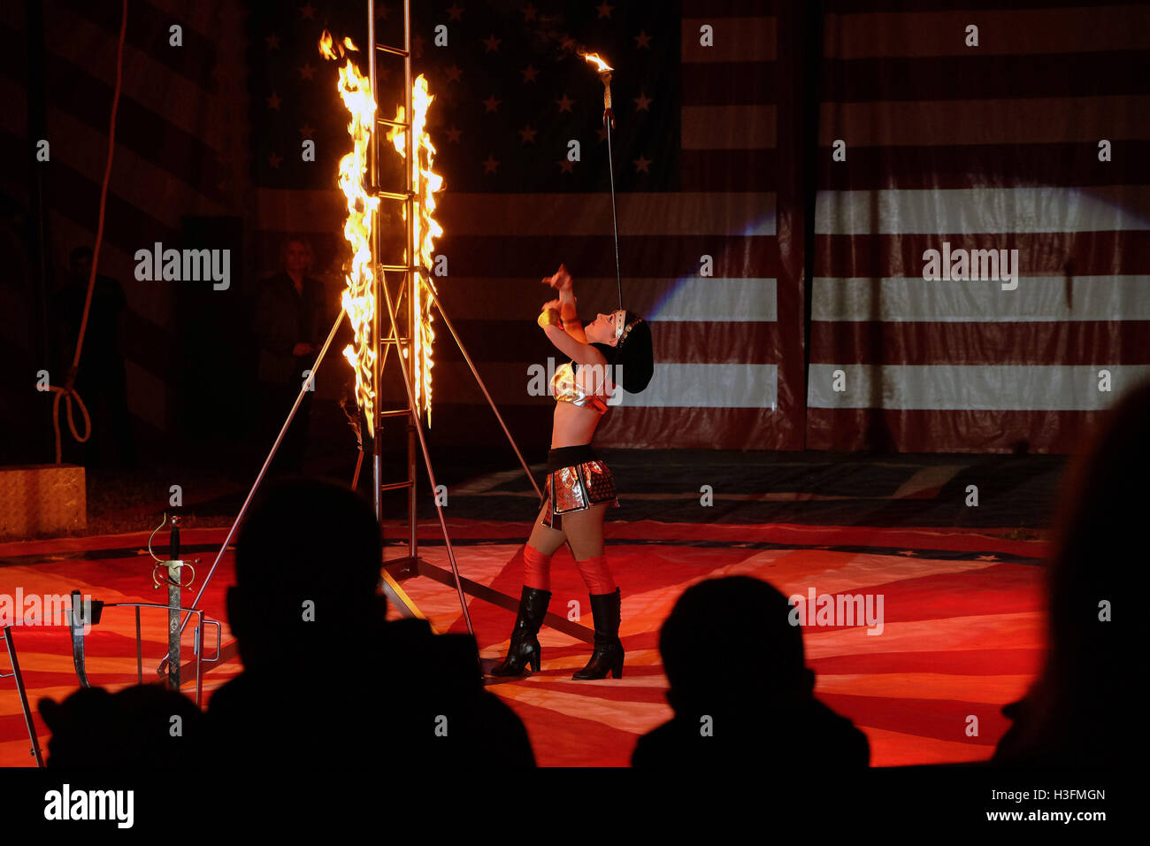 A sword balancing act at Circus Vegas at Whitley Bay Stock Photo - Alamy