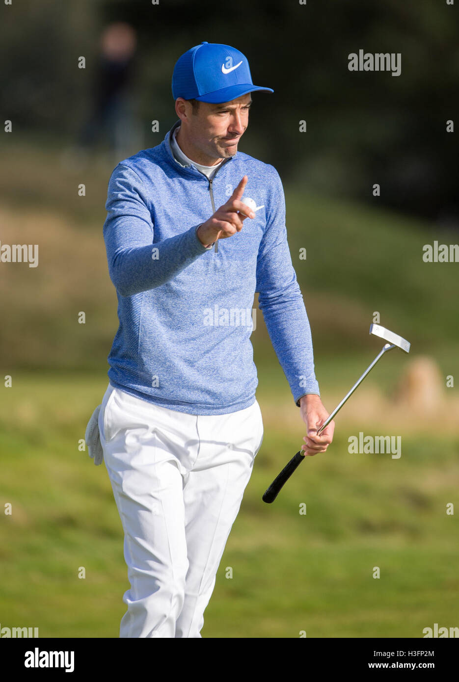 England's Ross Fisher acknowledges the fans on the 7th green following ...