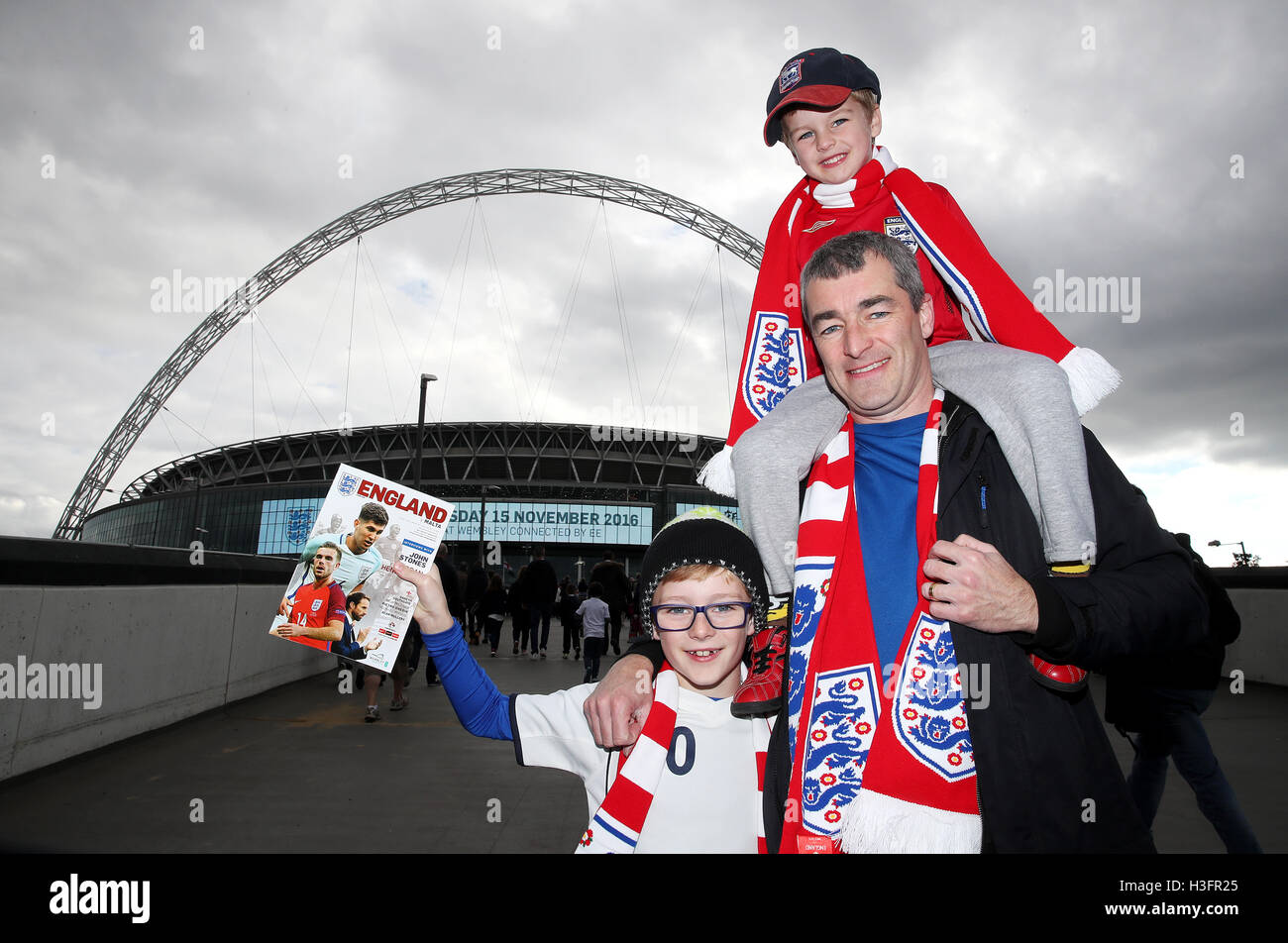 Phil Sadler and sons Finn and Theo from Ashford outside the ground ...