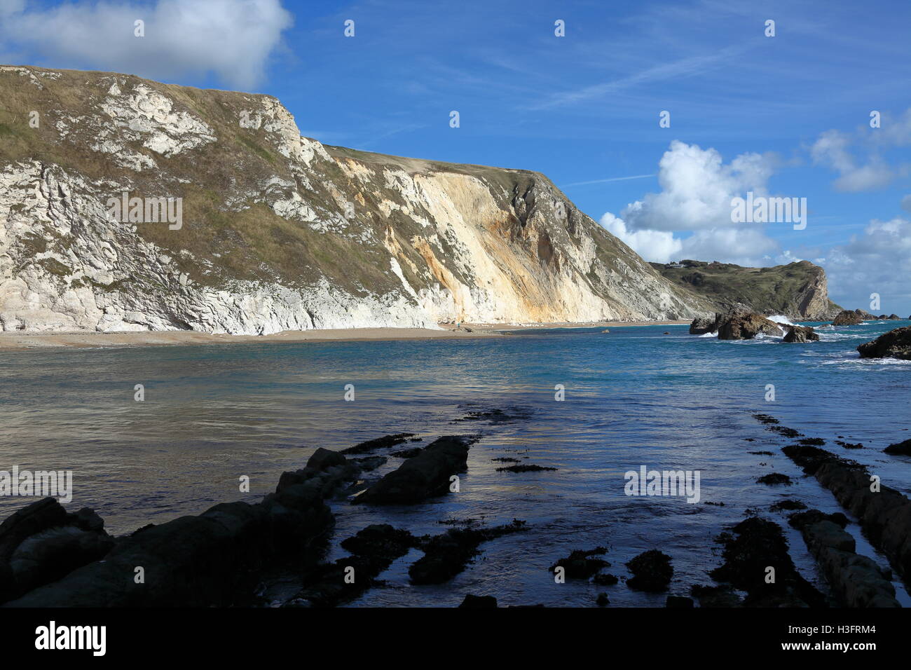 Looking across man of war bay at the high chalk cliffs above the blue ...