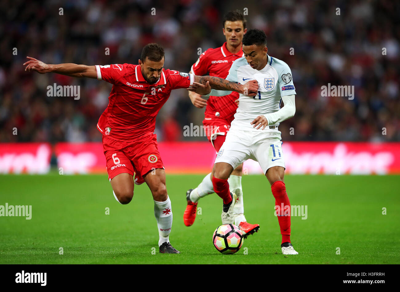 England's Jesse Lingard (right) in action with Malta's Steve Borg (left ...