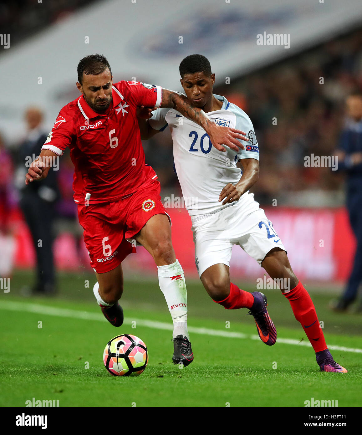 Malta's Andrew Hogg (left) and England's Marcus Rashford battle for the ...