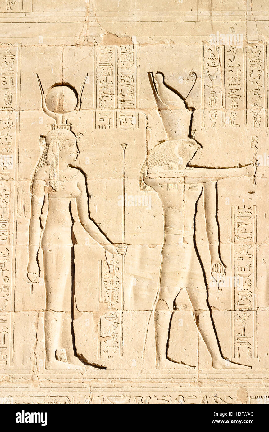 Wall relief of the falcon-headed god Horus and his wife Hathor at the ...