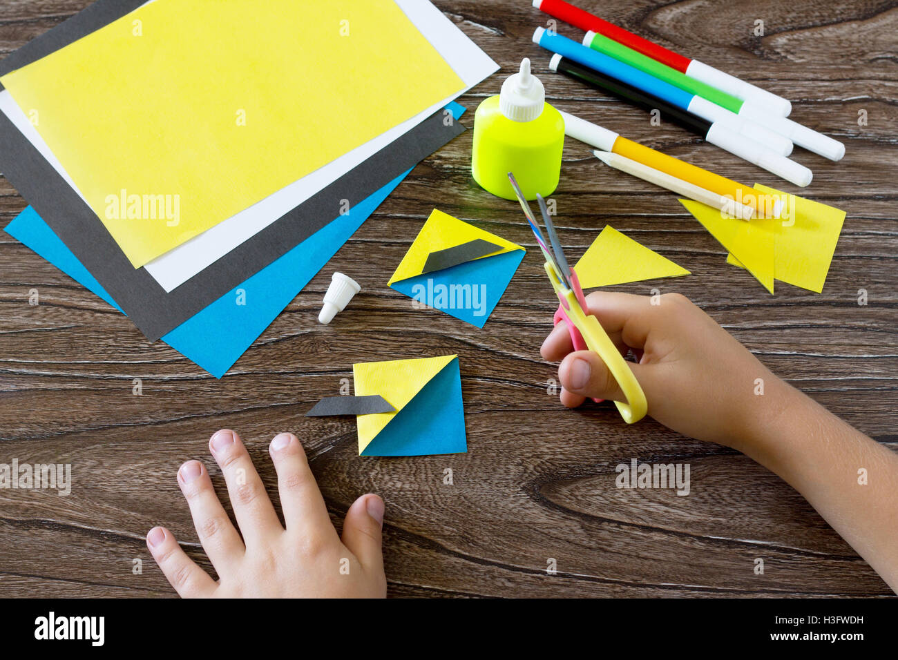 The child makes a book with a bookmark mignon. The child carves the ...