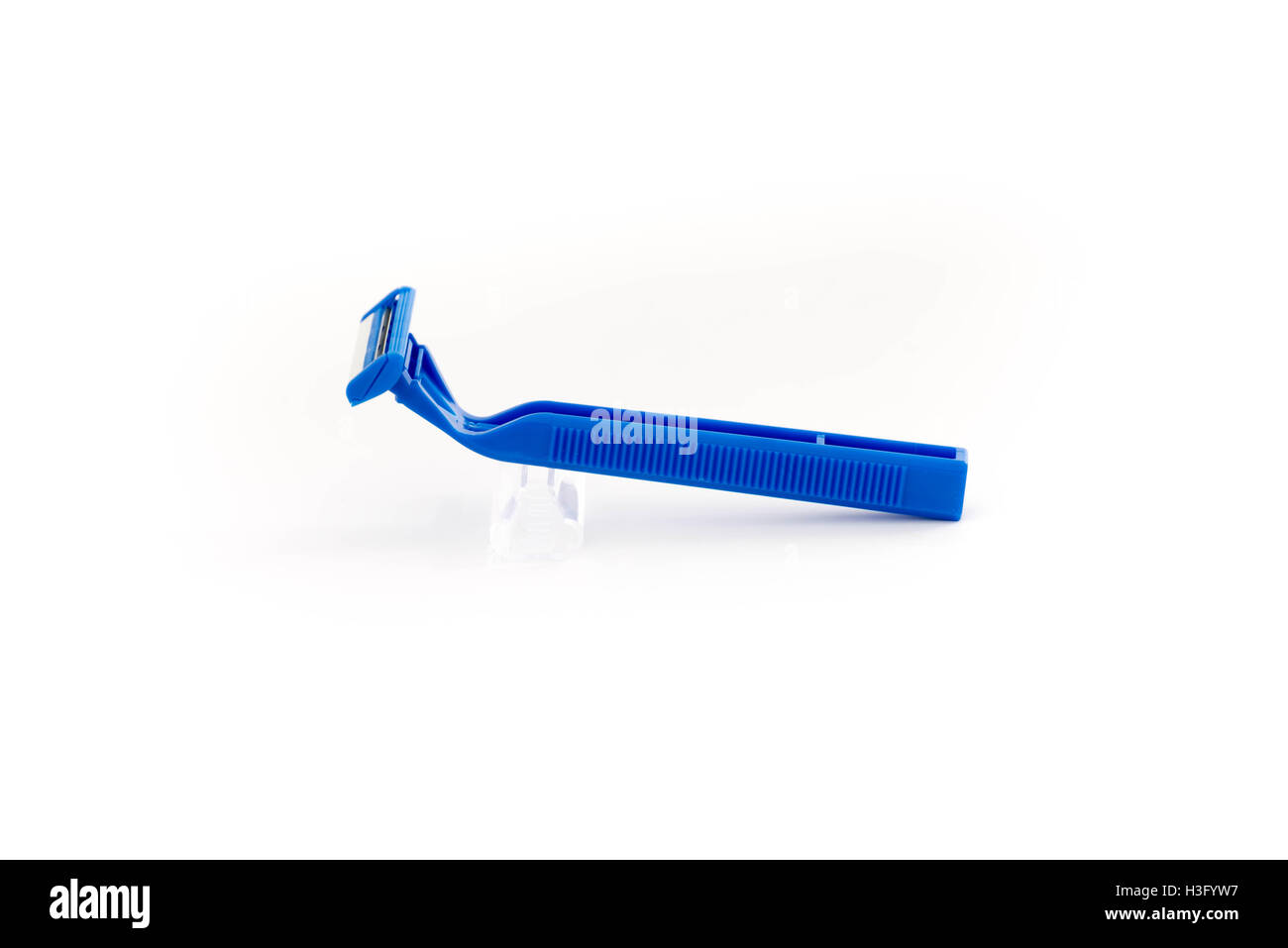 Blue shaving razor on a white background Stock Photo - Alamy