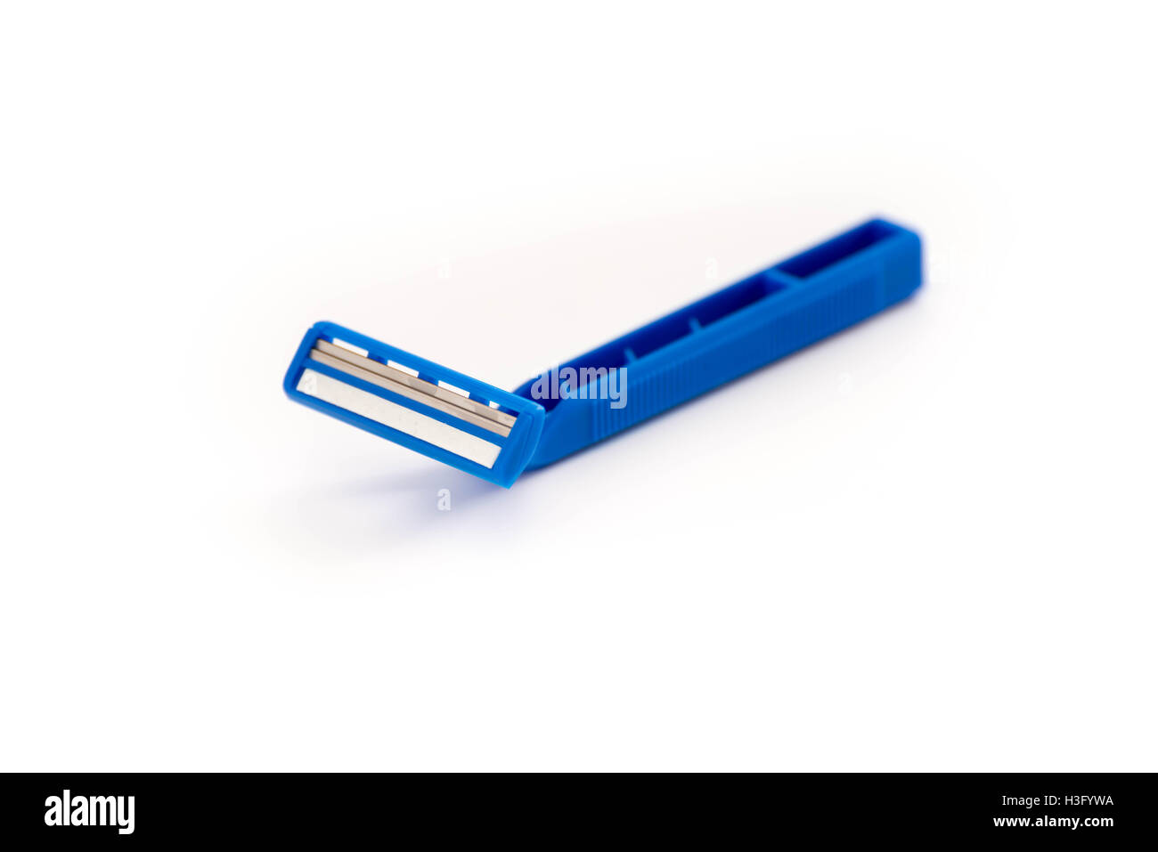 Blue shaving razor on a white background Stock Photo - Alamy