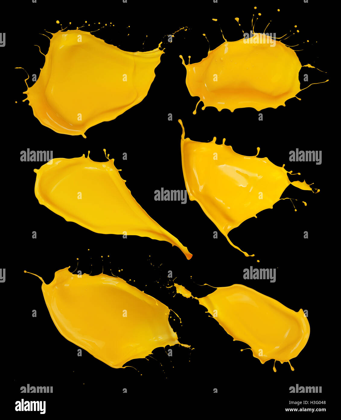 abstract yellow splashes isolated on black background Stock Photo - Alamy