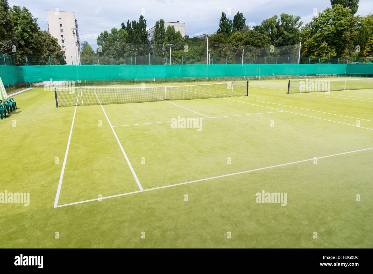 Empty grass tennis court Stock Photo - Alamy