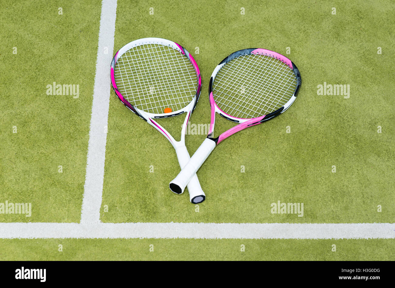 Tennis racket and balls lying on court hi-res stock photography and ...