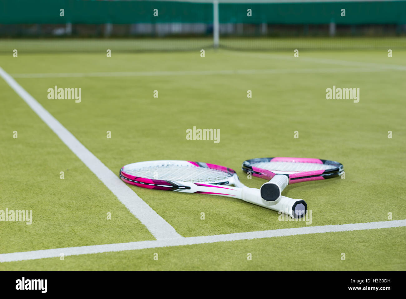 Tennis racket and balls lying on court hi-res stock photography and ...