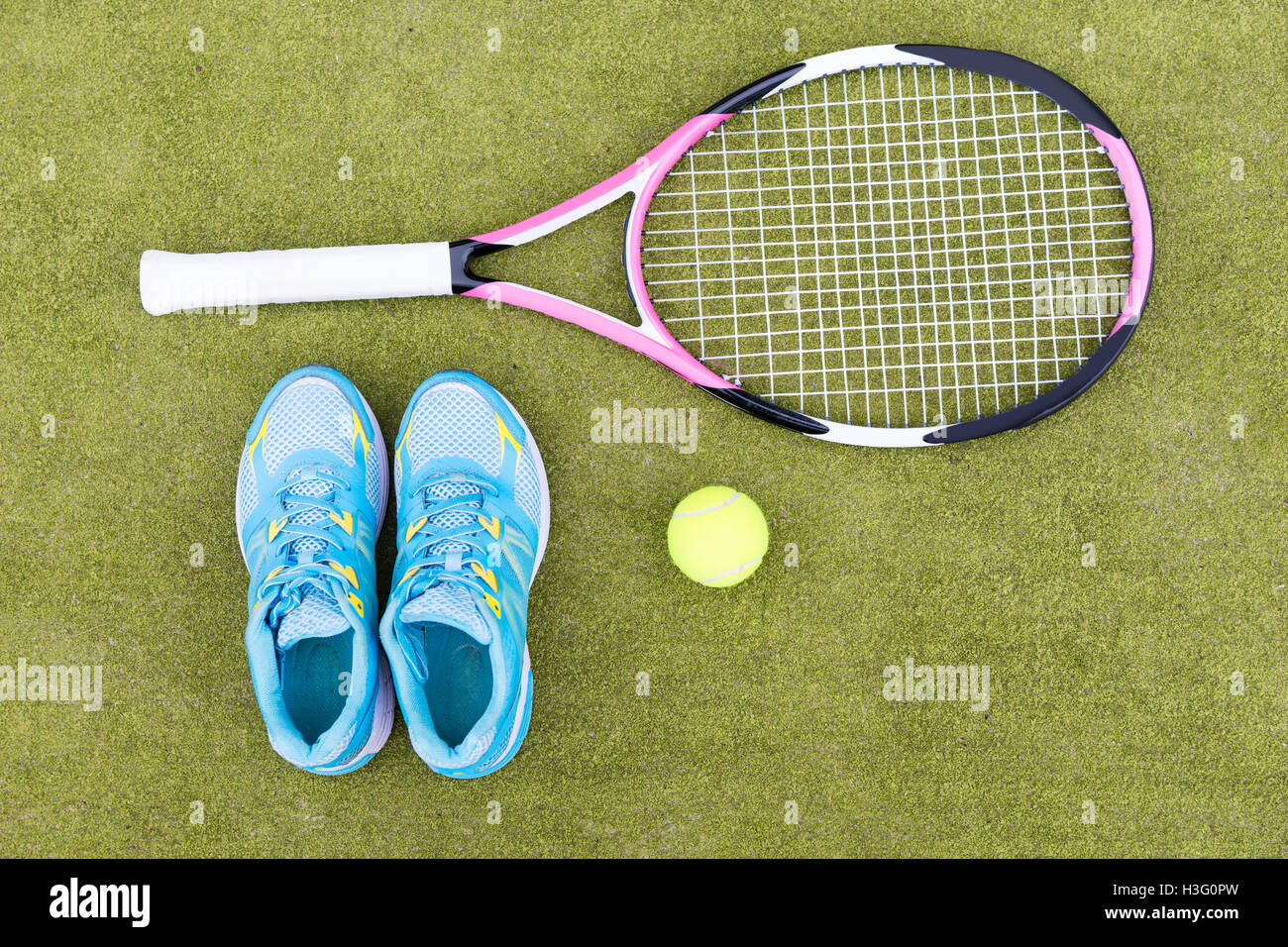 Tennis equipment set of tennis racket, ball and female sneakers on ...