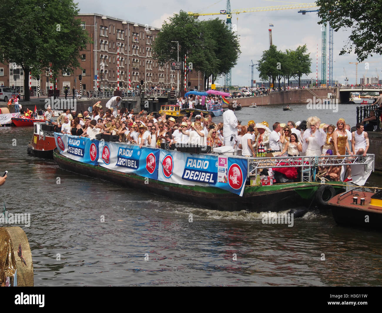 This image captures the vibrant and colorful Pride Canal Parade held in ...