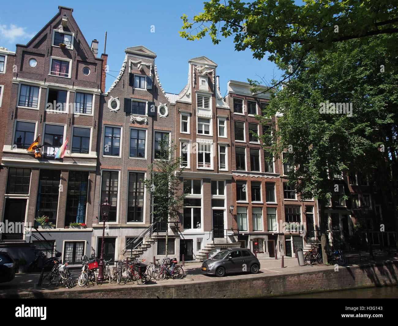 This photograph captures the iconic Leidsegracht canal in Amsterdam, situated between ...