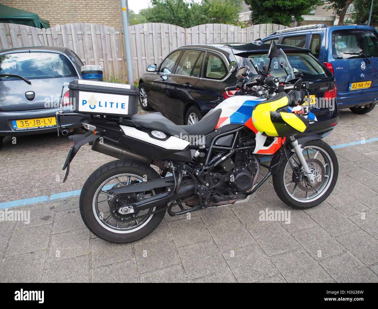 A BMW police motorcycle is captured in Hoofddorp, showcasing modern ...