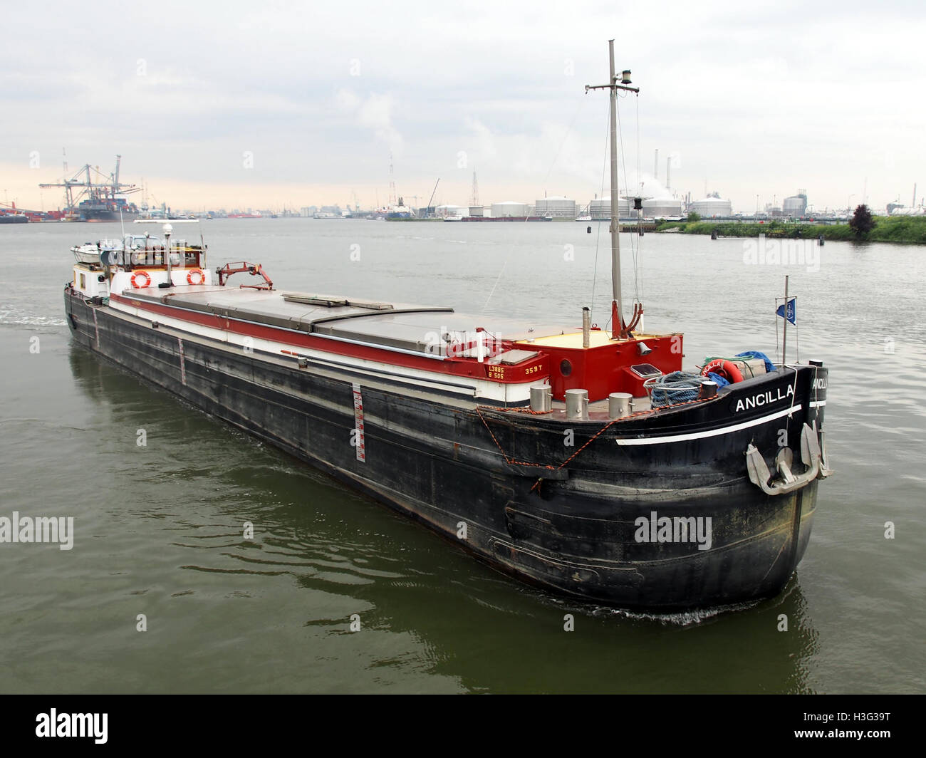 The photograph shows the Ancilla, a ship built in 1959, docked at the ...