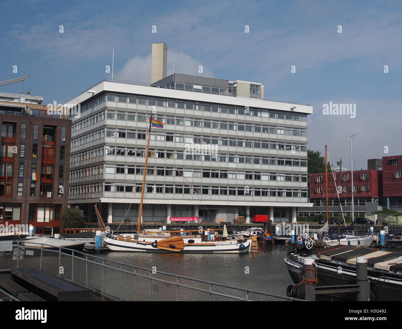 The image depicts the Westerdok area in Amsterdam, known for its scenic ...