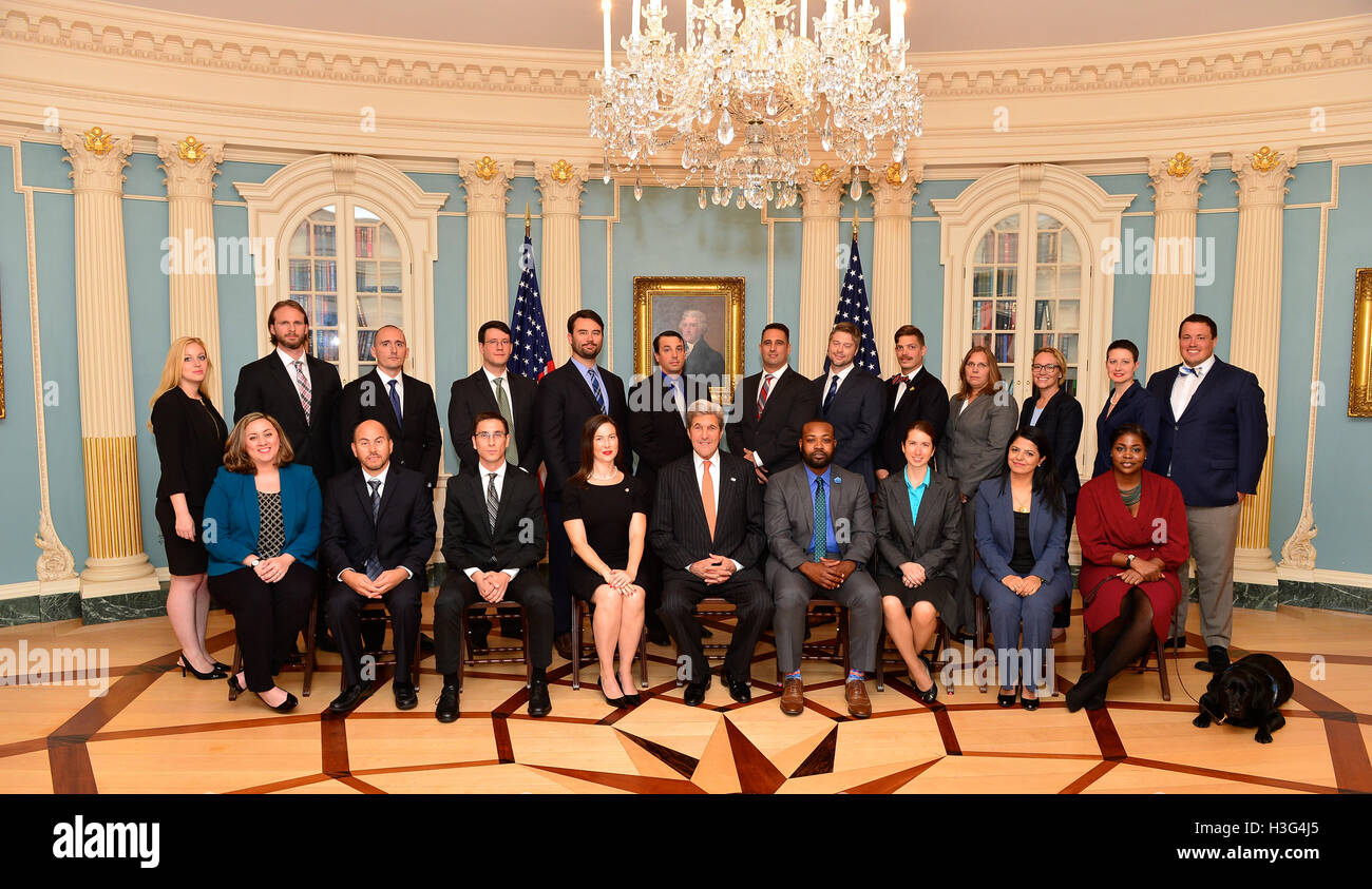 U.S. Secretary of State John Kerry poses for a photo with Veterans ...