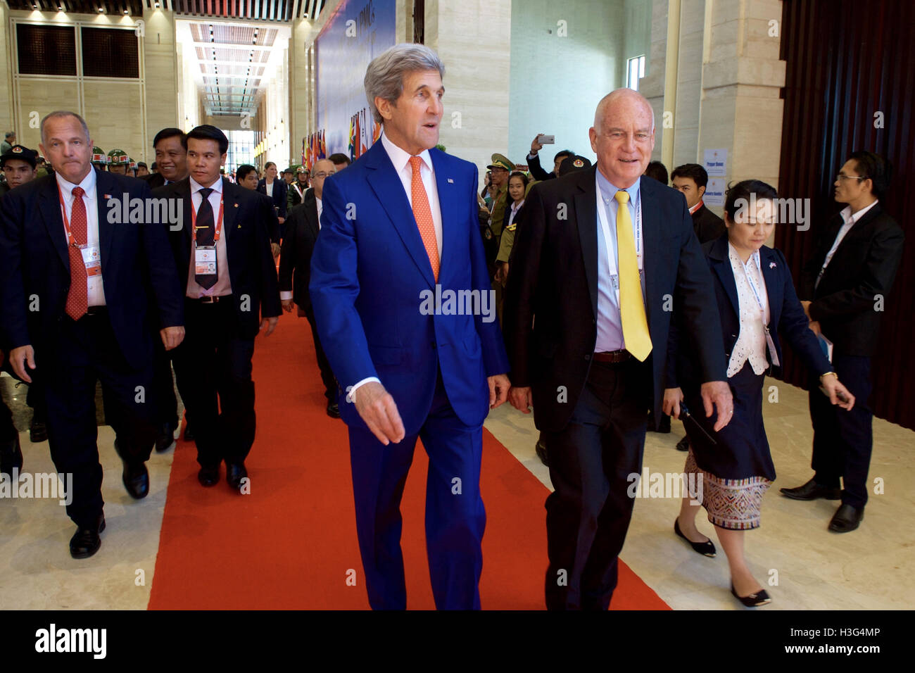 U.S. Secretary of State John Kerry walks with U.S. Ambassador to Laos ...