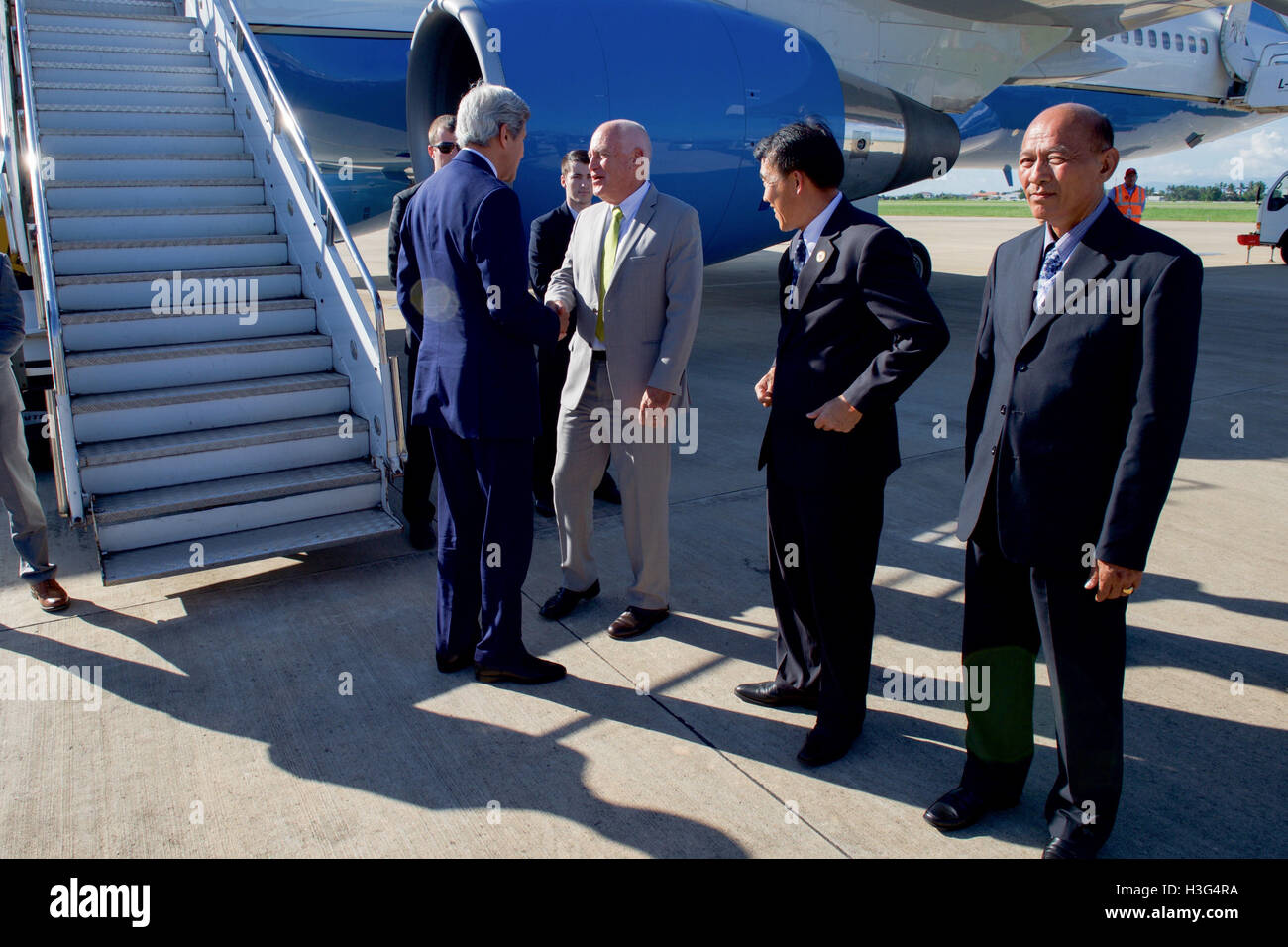 U.S. Secretary of State John Kerry bids farewell to members of a ...
