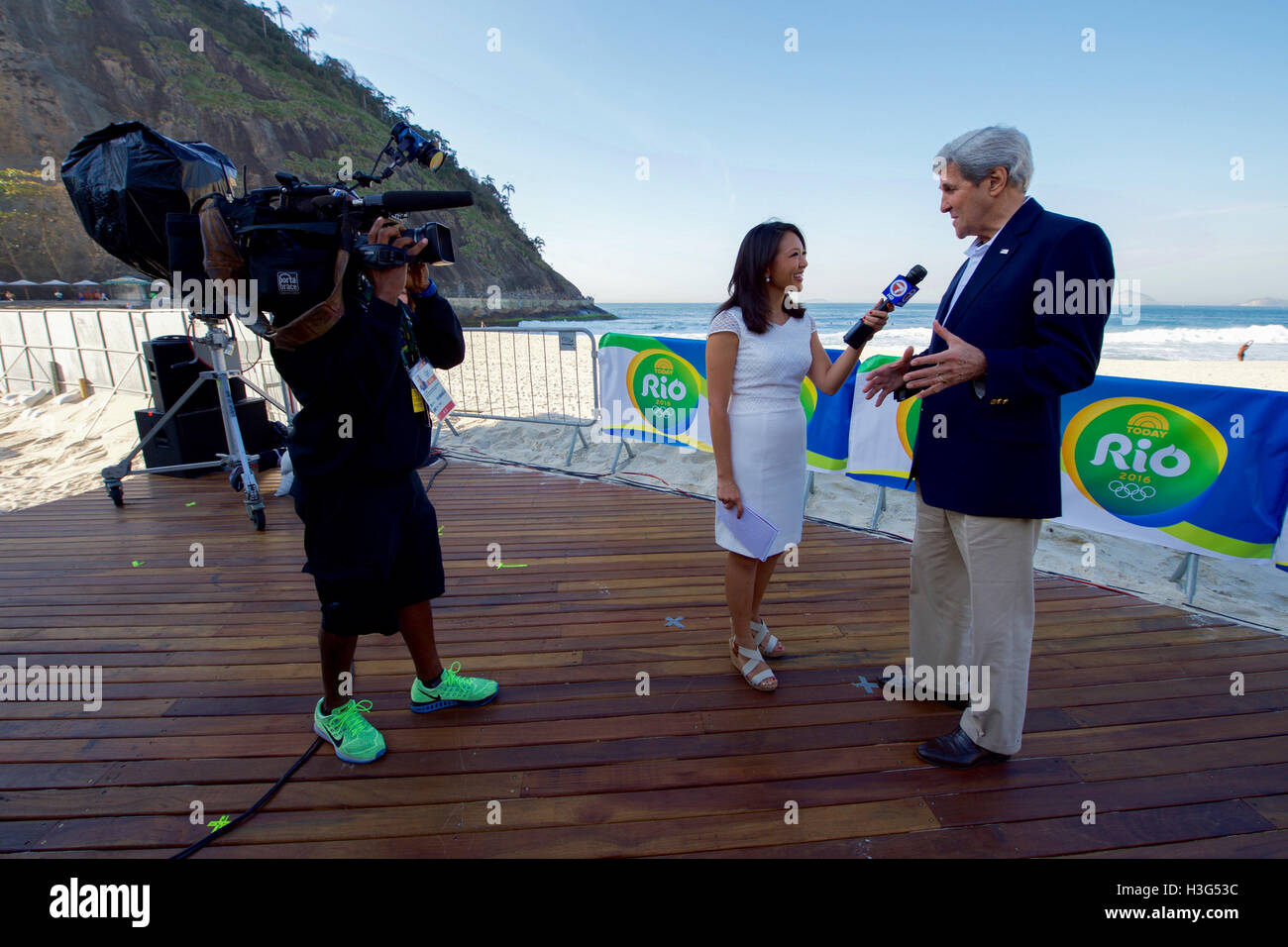 U.S. Secretary of State John Kerry speaks with reporter Nancy Chen of ...