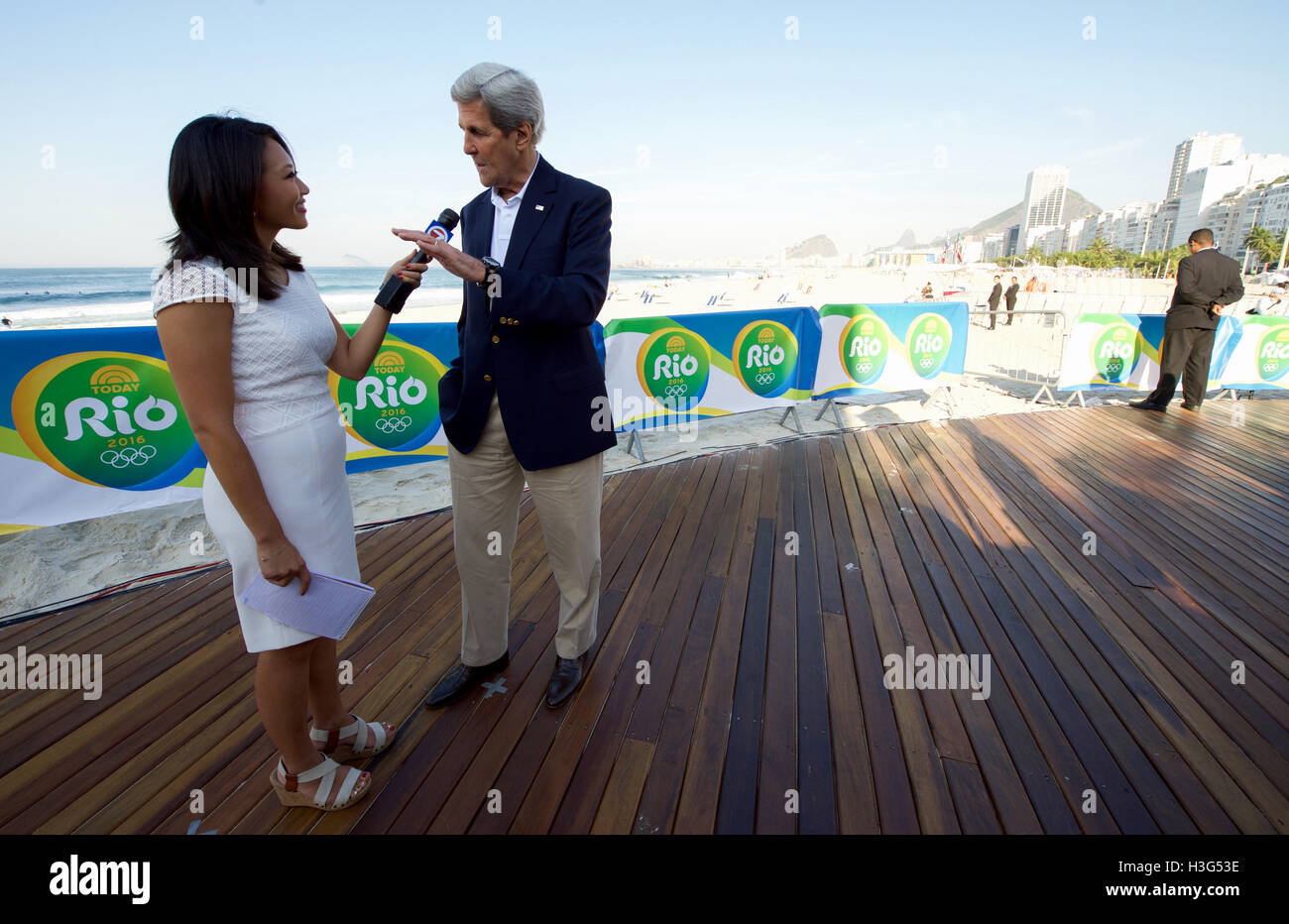 U.S. Secretary of State John Kerry speaks with reporter Nancy Chen of ...
