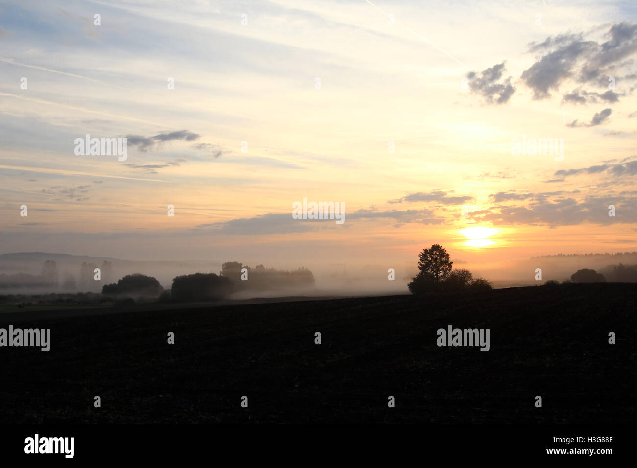 Dawn over rural countryside Stock Photo - Alamy