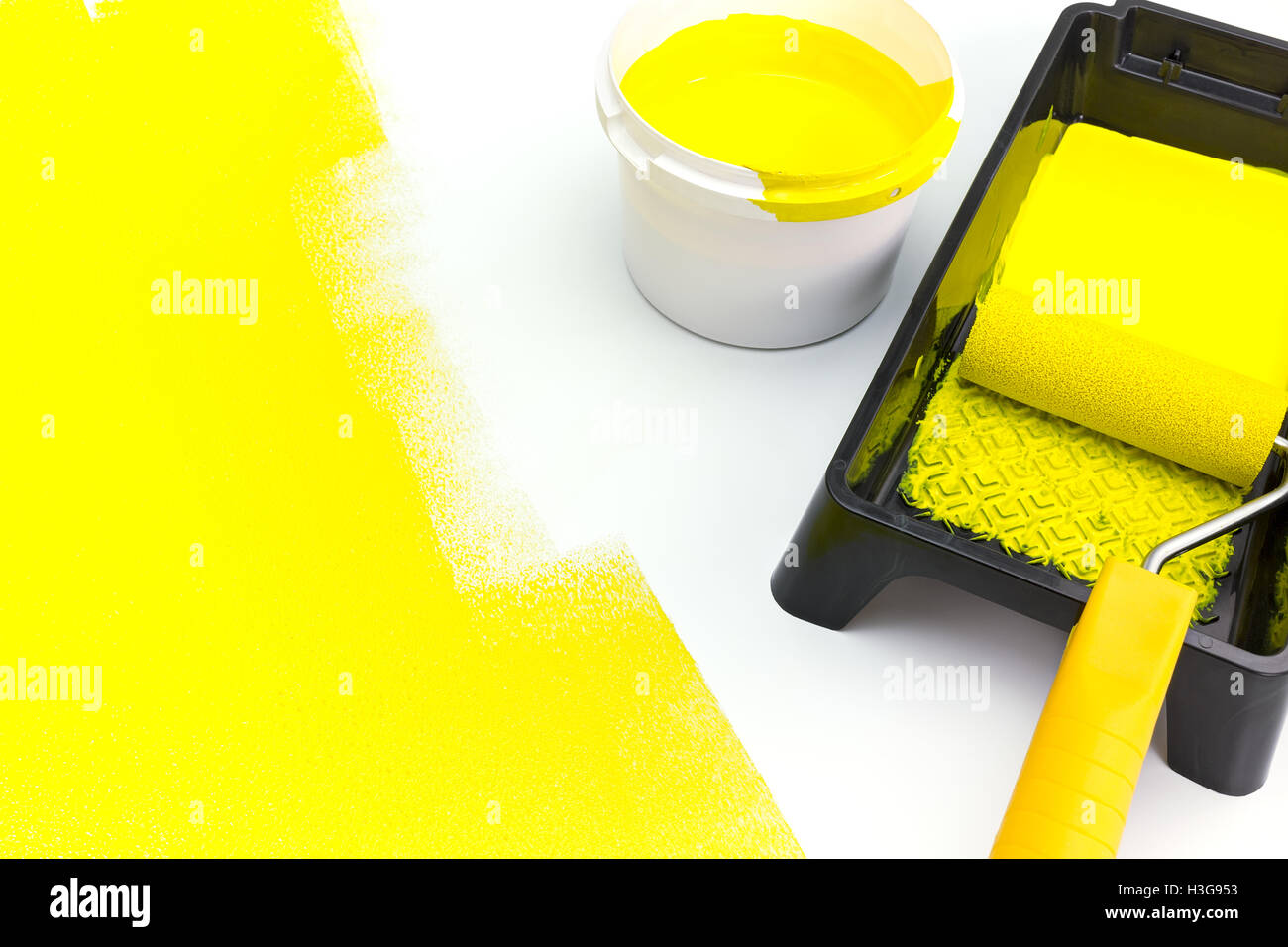Yellow background paint roller hi-res stock photography and images - Alamy