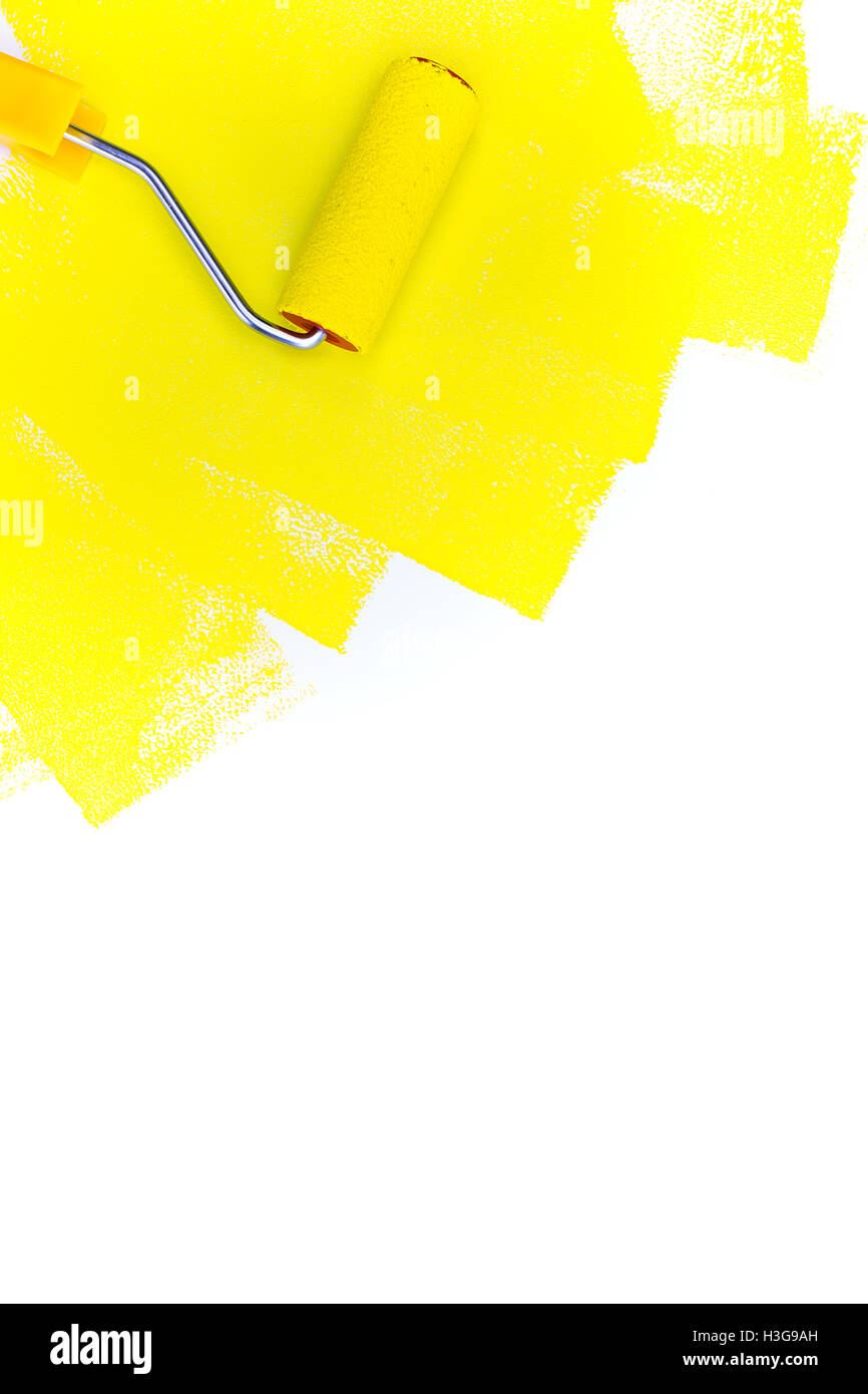 paint roller with yellow paint on white background Stock Photo - Alamy